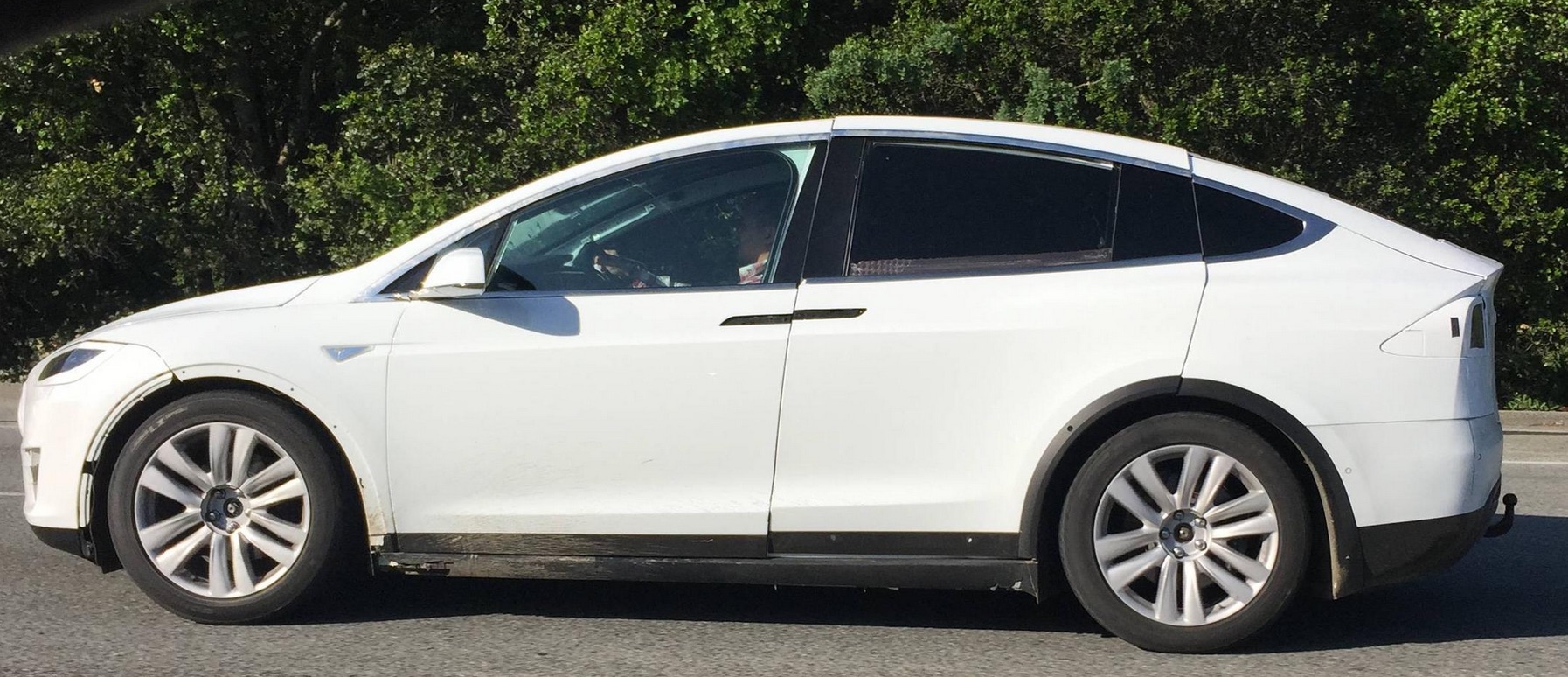 Model X with trailor hitch and Falcon wing doors partially open seen on ...