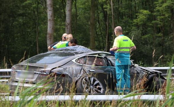 Tesla Model S driver and 8-yr-old son survive 80mph rollover truck ...
