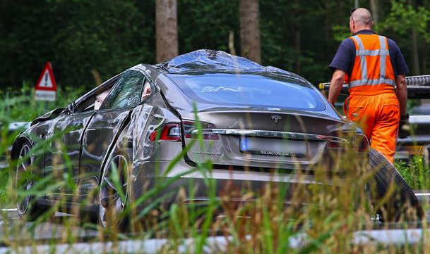Tesla Model S driver and 8-yr-old son survive 80mph rollover truck ...