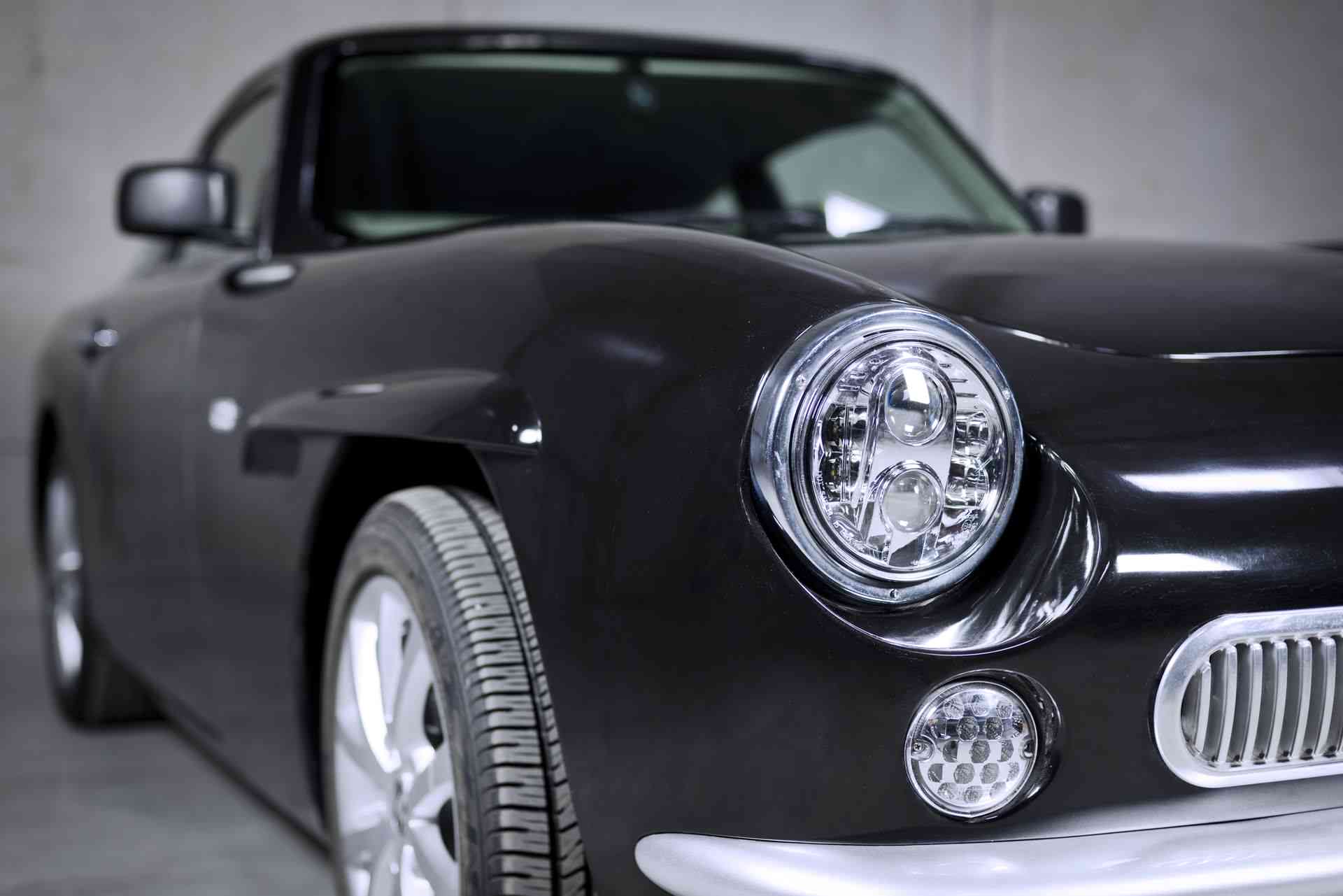 EV startup unveils new retro-looking electric car with in-wheel hub ...