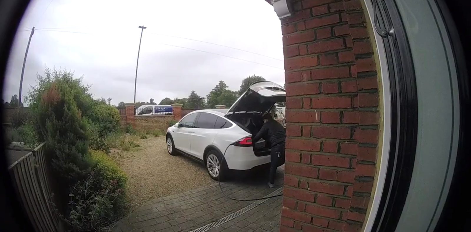 Watch how a Tesla owner takes remote delivery of a package with his ...