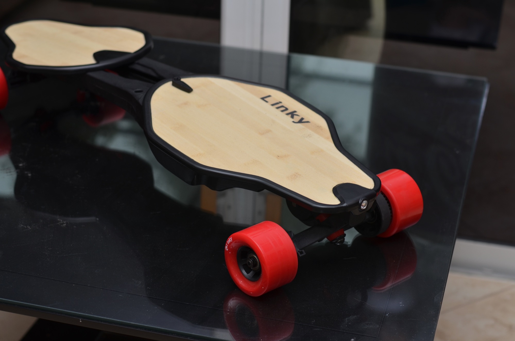 Linky folding electric longboard review: four-wheeled EV fun that fits ...