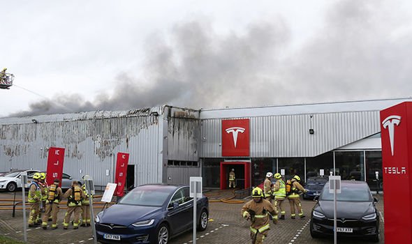 Tesla store caught on fire in Surrey, half the building has been ...