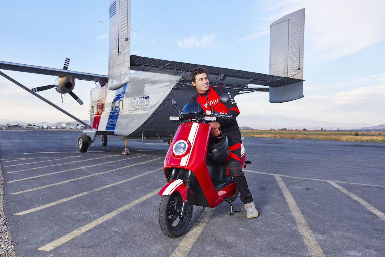 Watch this NIU electric scooter ride out of an airplane in skydiving stunt