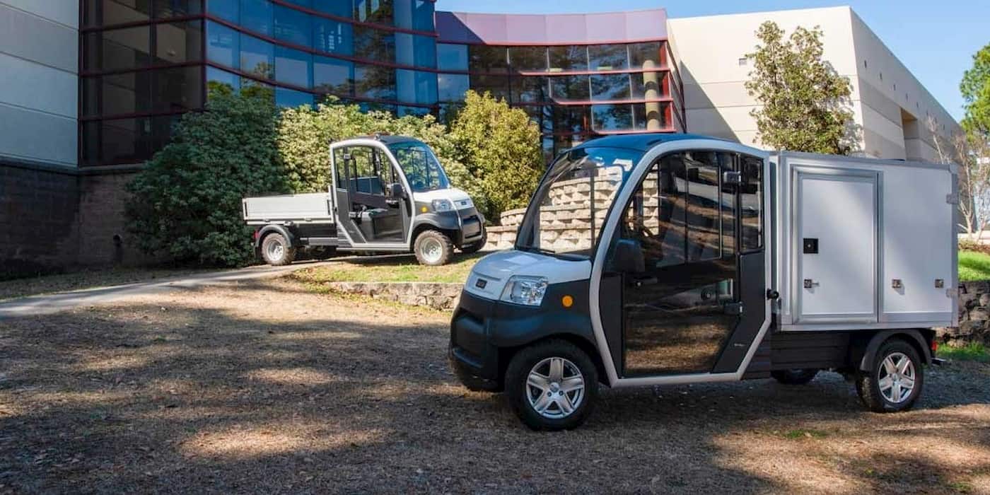 This electric utility vehicle is a mini pickup with a dump truck bed