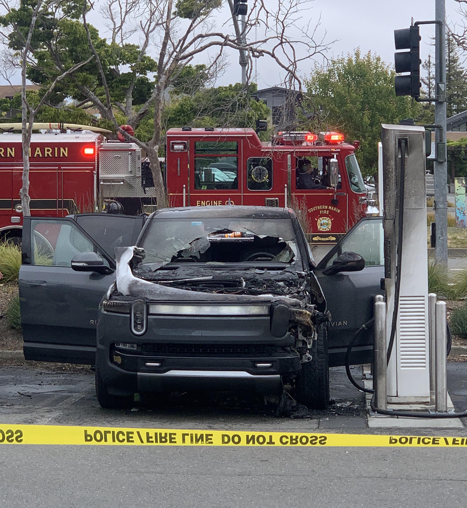 Rivian electric pickup caught fire while charging at Electrify America ...