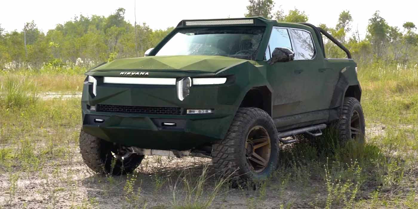 This custom Rivian has been fit with a lift kit, kevlar paint, roll cage