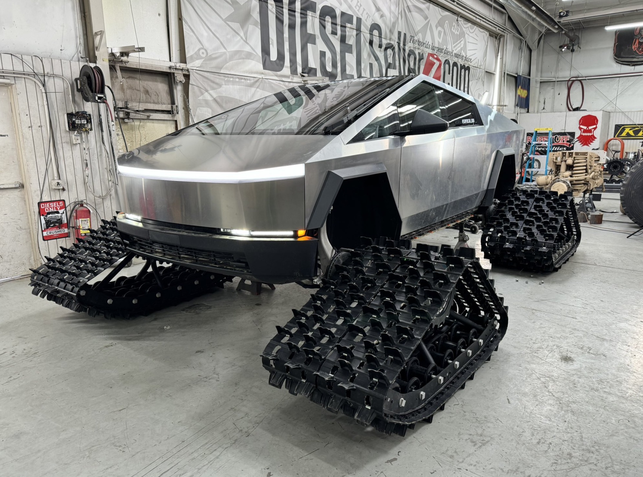 Tesla Cybertruck turns into a tank with massive snow tracks | Electrek