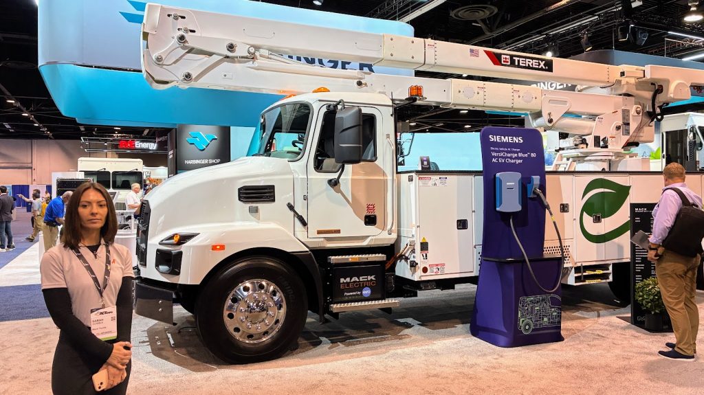 Mack Pioneer Electric and rear loader MR garbage trucks at ACT