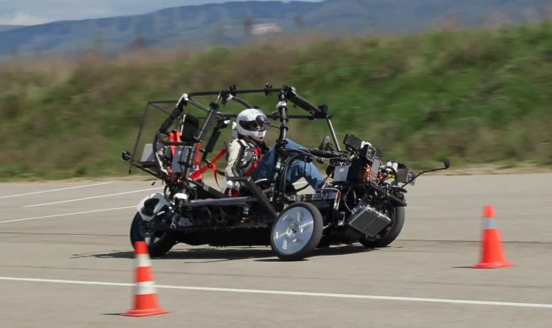 This 75 MPH electric car has functional bicycle pedals to charge it
